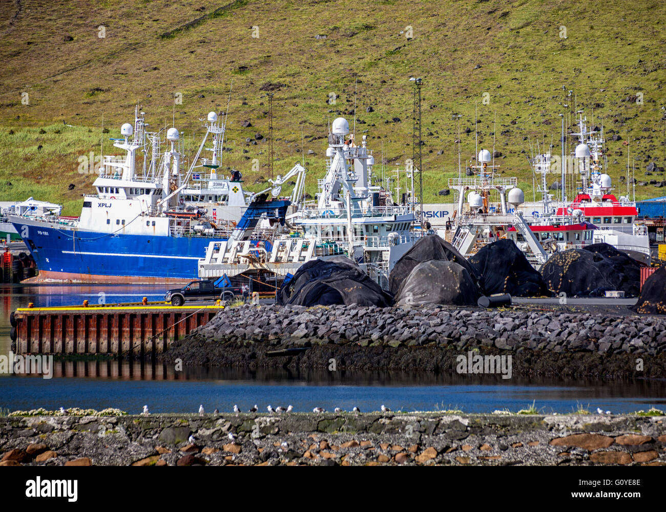 August 3, 2015 - Fishing trawlers in Heimaey harbor beneath the ...