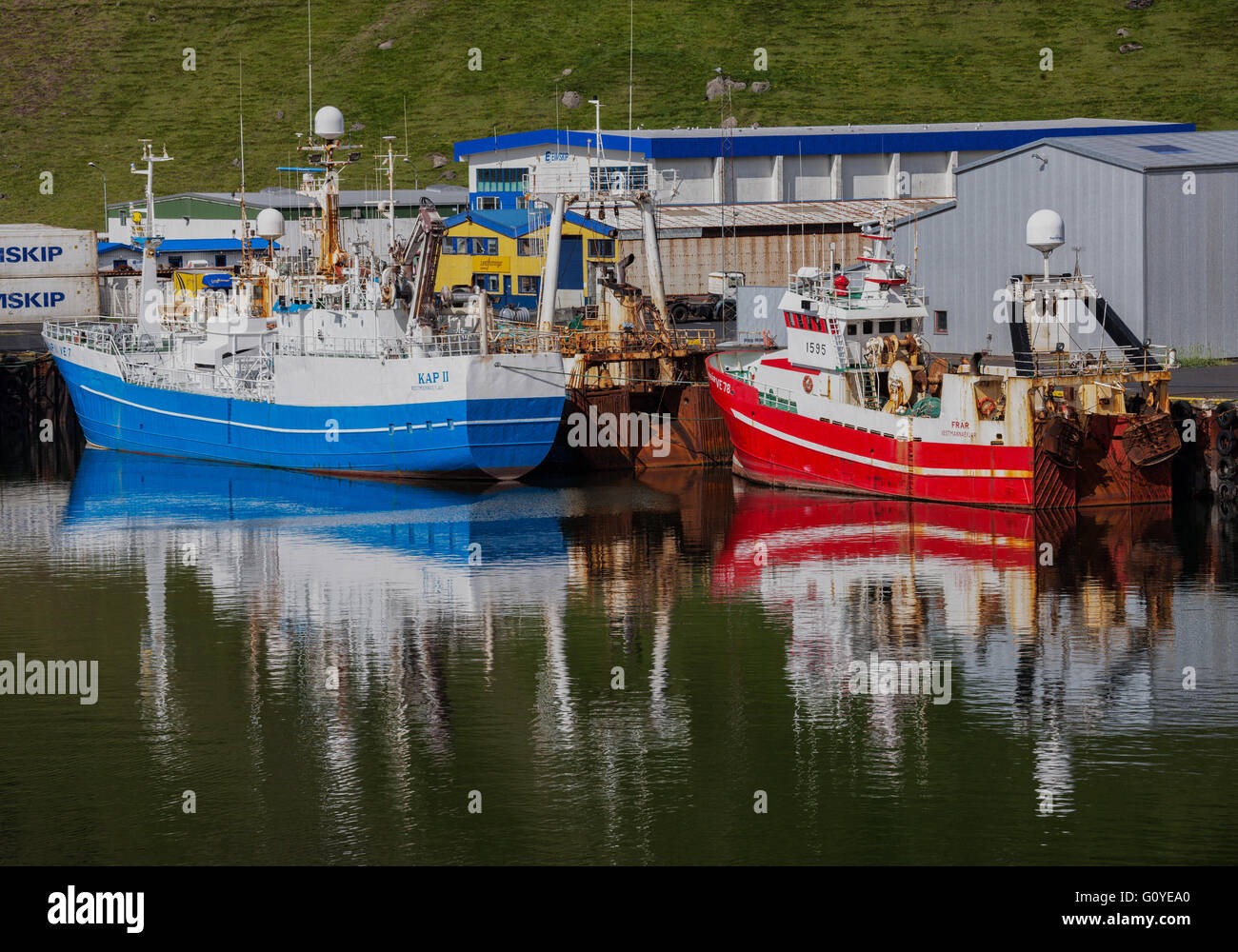 August 3, 2015 - Fishing trawlers in Heimaey harbor beneath the ...