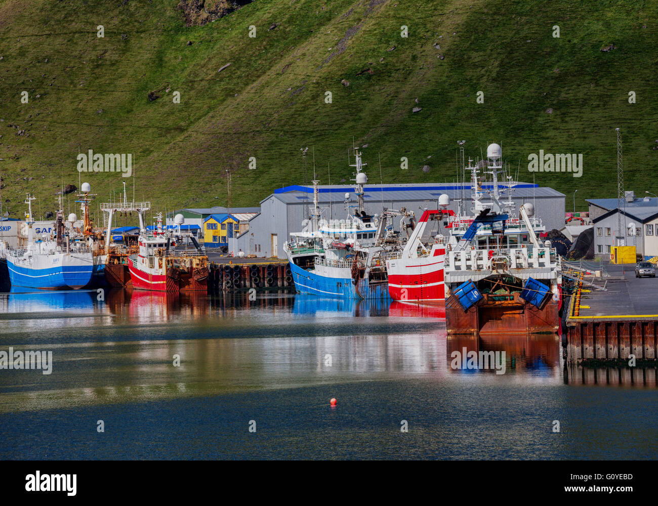 August 3, 2015 - Fishing trawlers in Heimaey harbor beneath the ...