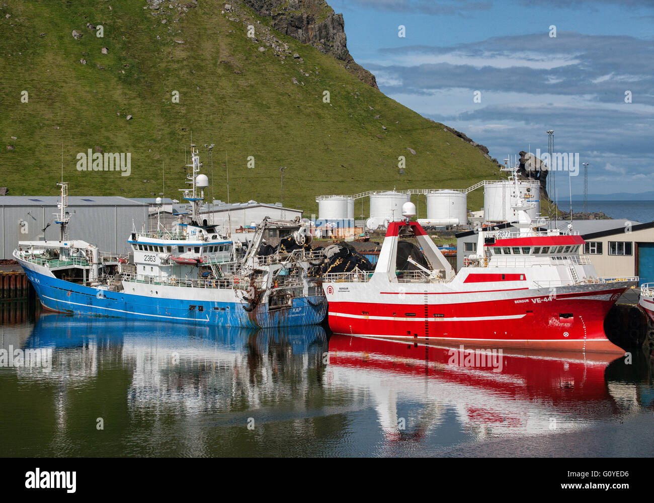 August 3, 2015 - Fishing trawlers in Heimaey harbor beneath the ...