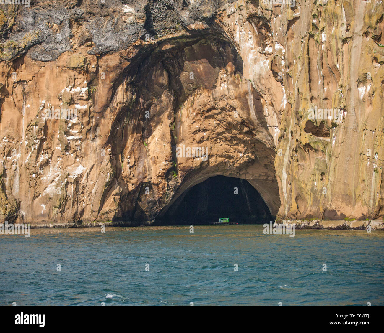 August 3, 2015 - The much visited Klettshellir Cave below rugged ...