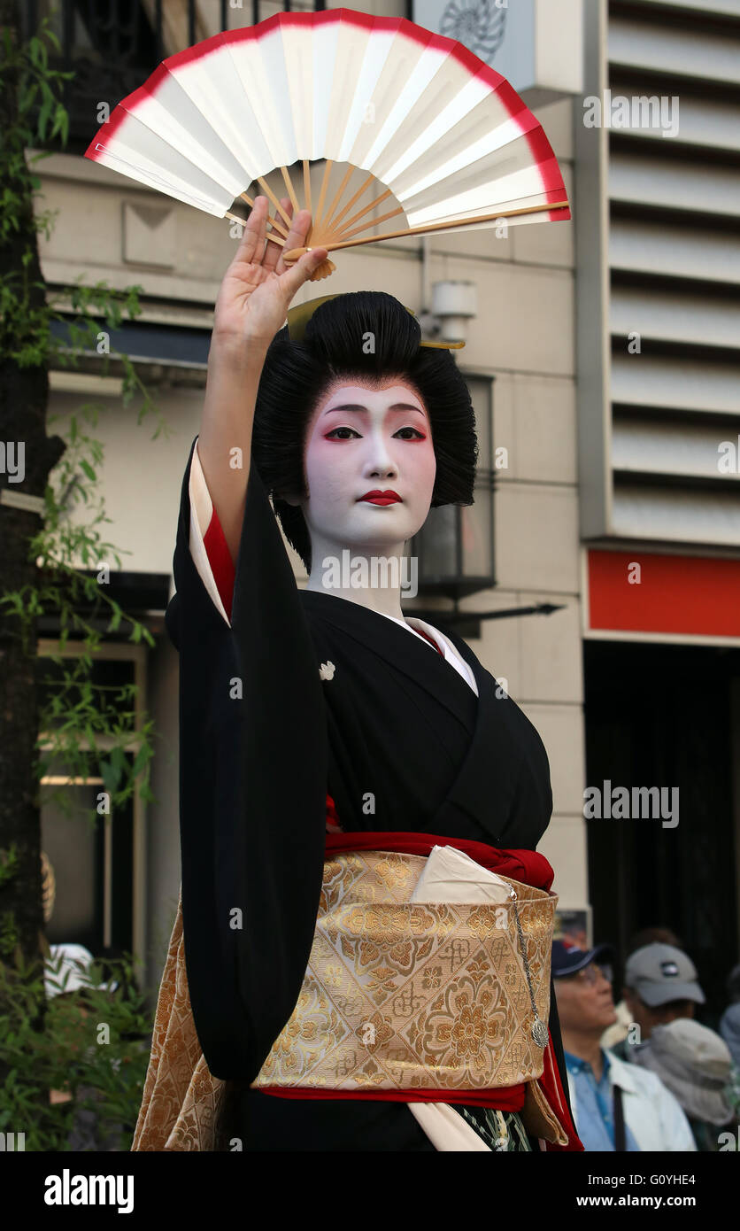 Tokyo, Japan. 5th May, 2016. A geisha with a folding fan performs ...