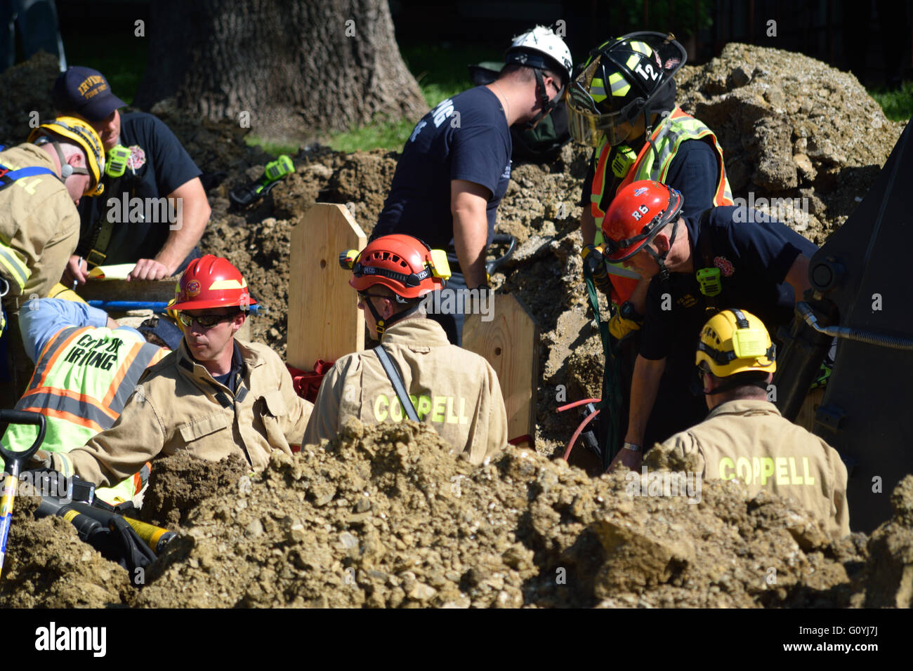 Irving, TX, USA. 5th May, 2016. Rescue workers help dig out a ...