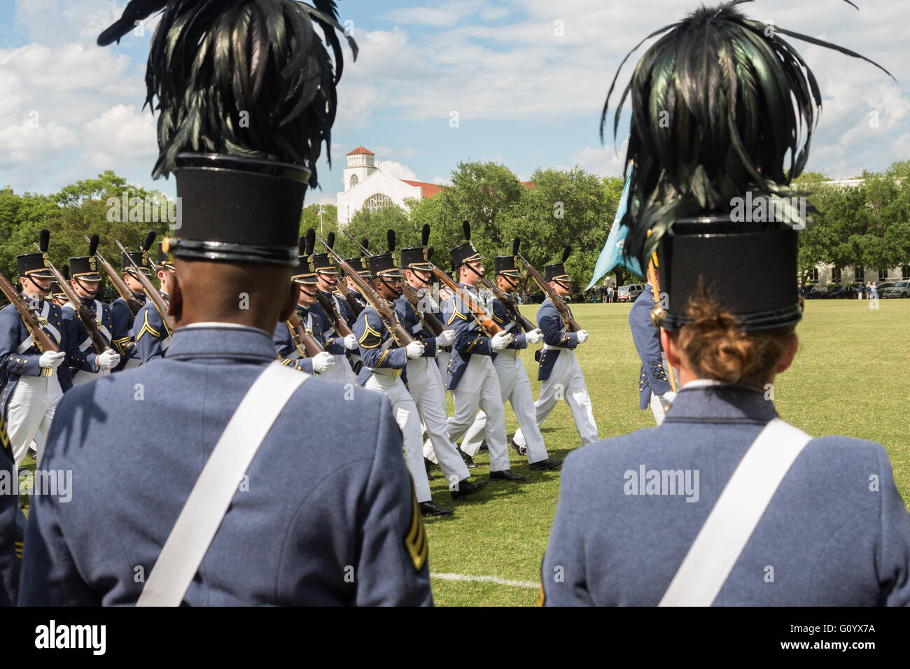 Graduating senior cadets watch underclassmen parade past in their honor ...