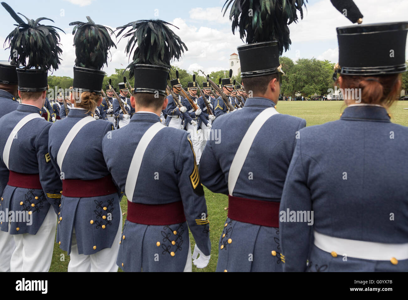 Graduating senior cadets watch underclassmen parade past in their honor ...
