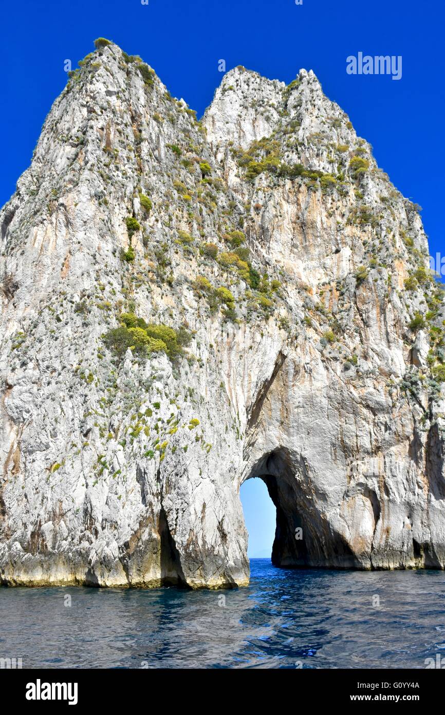 Famous rock in the ocean off the coast of Capri Stock Photo - Alamy