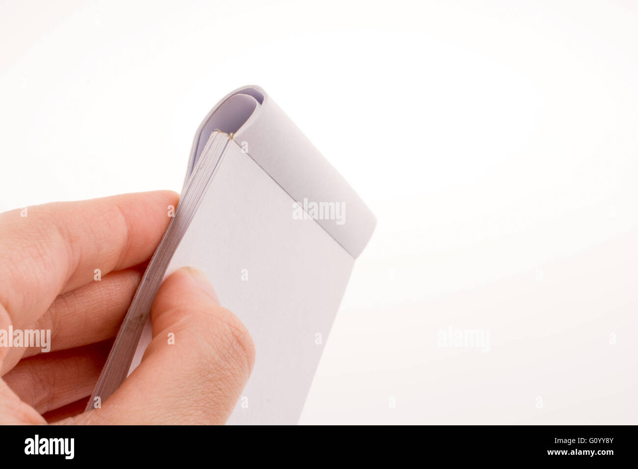 White little notebook in hand on a white background Stock Photo - Alamy