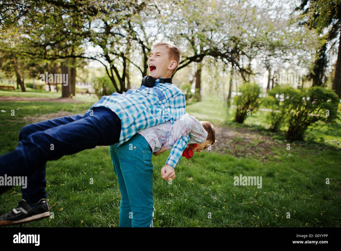 Two brother boy with headphones having fun on park. Brother love Stock ...