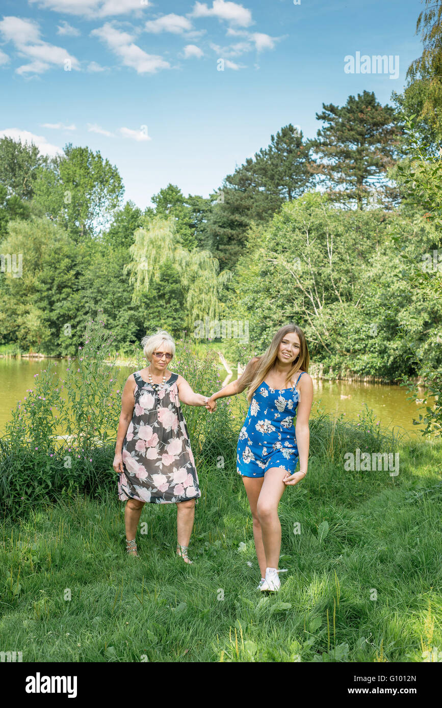 Girl Pulls Her Hand Woman Mother And Daughter Walking Grandmother And