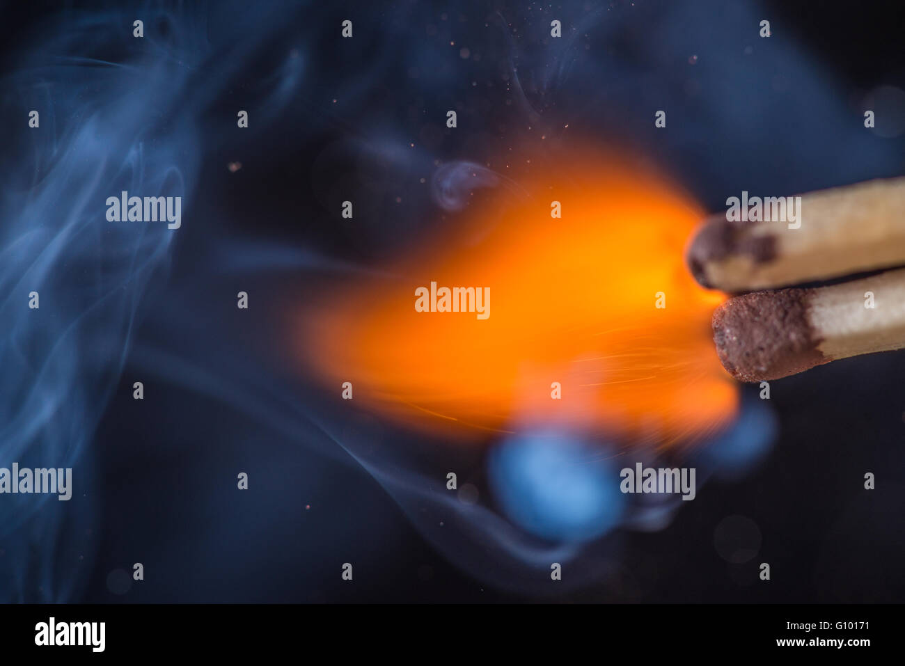 Match with smoke and fire on black background copyspace Stock Photo - Alamy