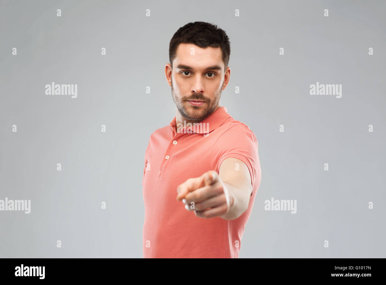 angry man pointing finger to you over gray Stock Photo - Alamy
