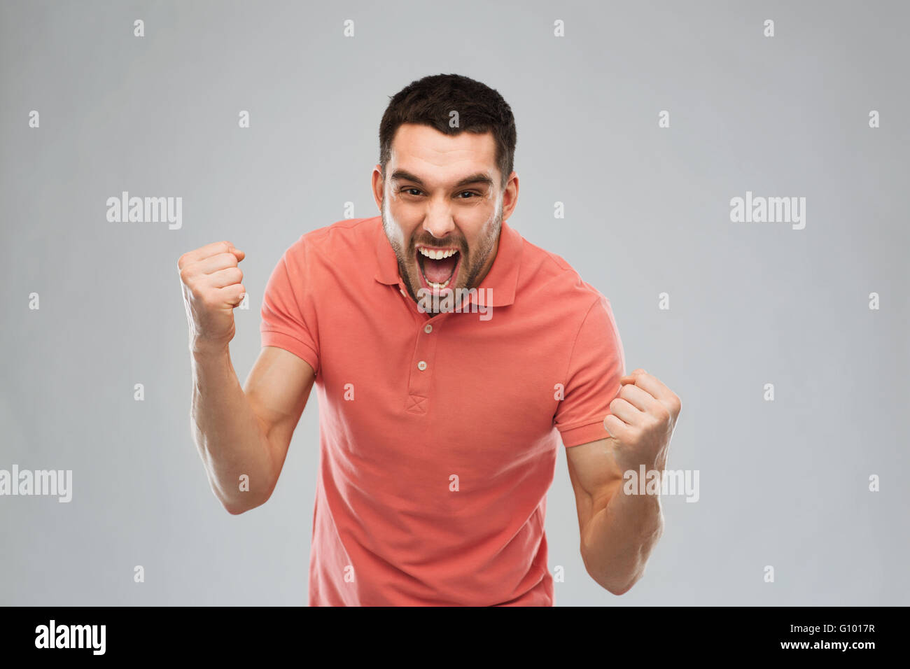 Happy man celebrating victory over hi-res stock photography and images ...