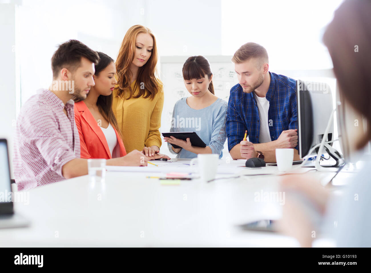 creative team with blueprint working at office Stock Photo - Alamy