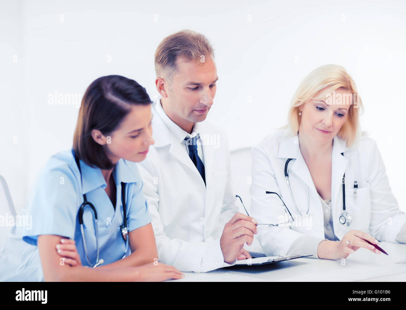 team or group of doctors on meeting Stock Photo - Alamy