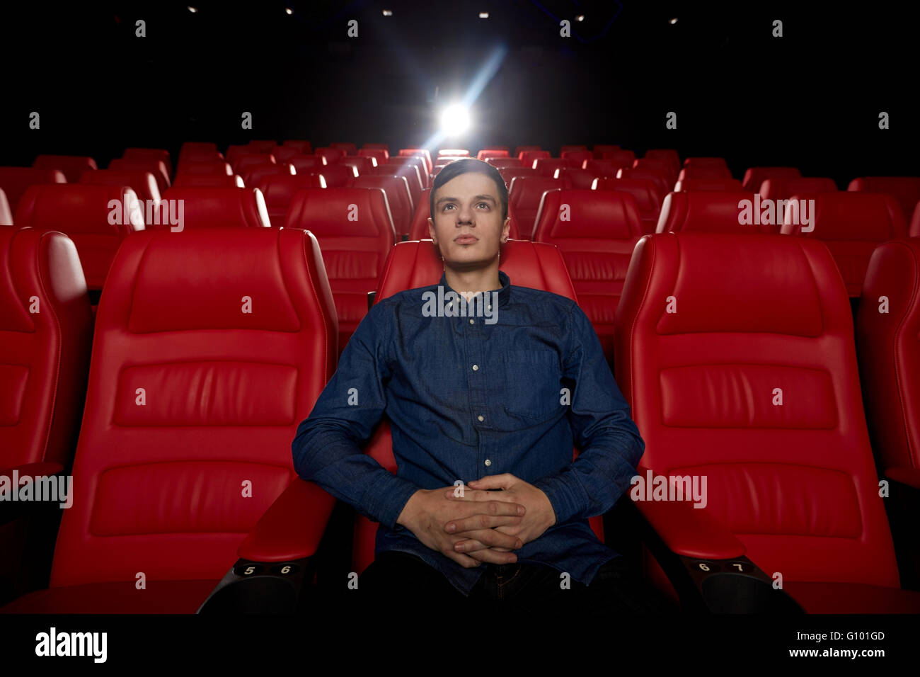 One man sitting in theater hi-res stock photography and images - Alamy