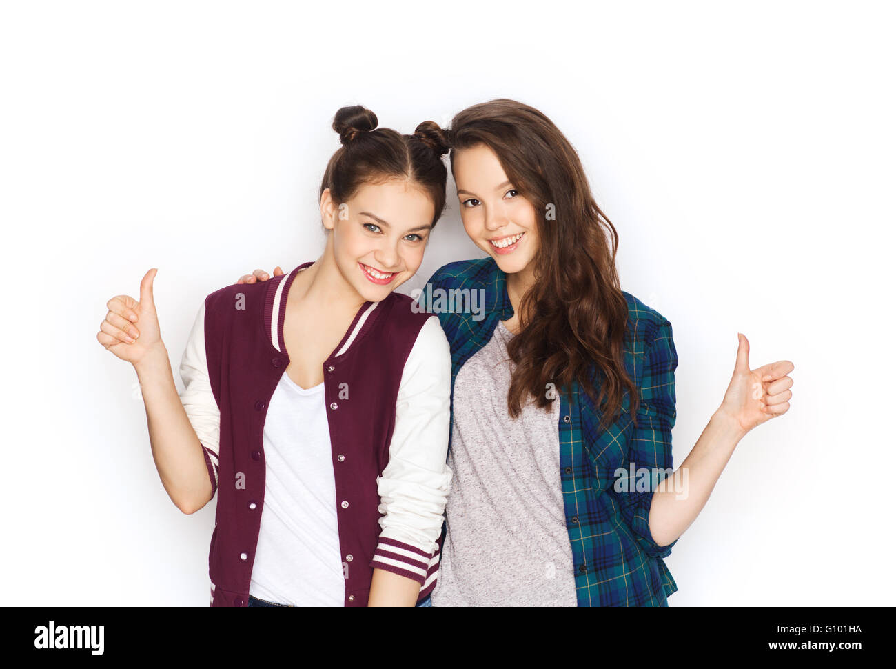 happy smiling teenage girls showing thumbs up Stock Photo - Alamy