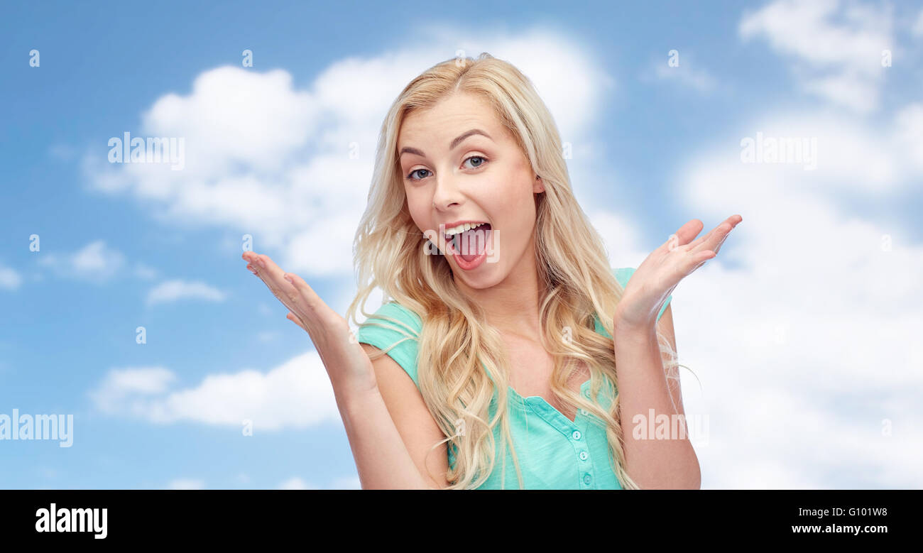 surprised smiling young woman or teenage girl Stock Photo - Alamy