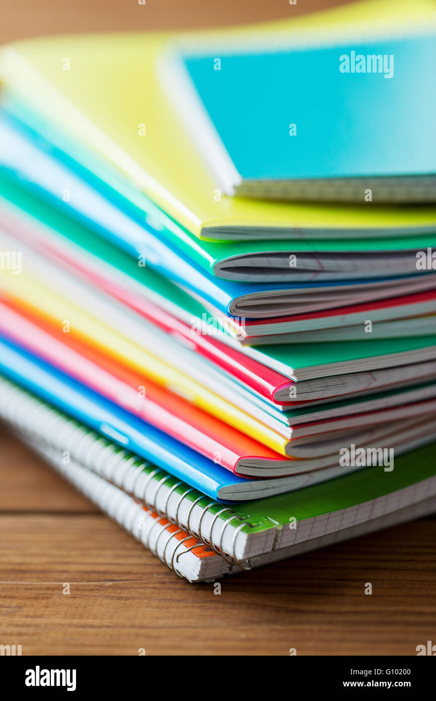 close up of notebooks on wooden table Stock Photo - Alamy