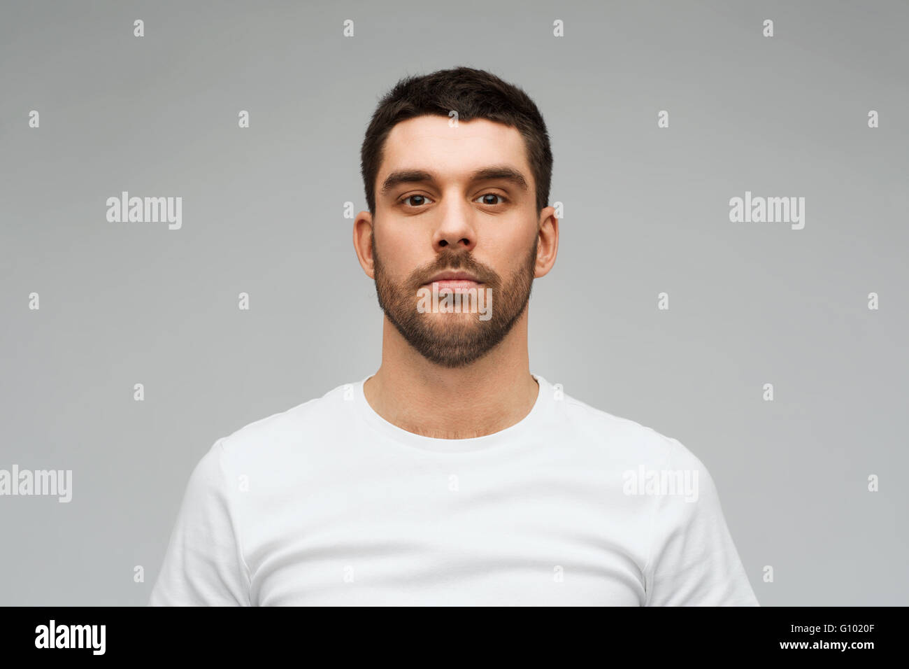 young man portrait over gray background Stock Photo - Alamy