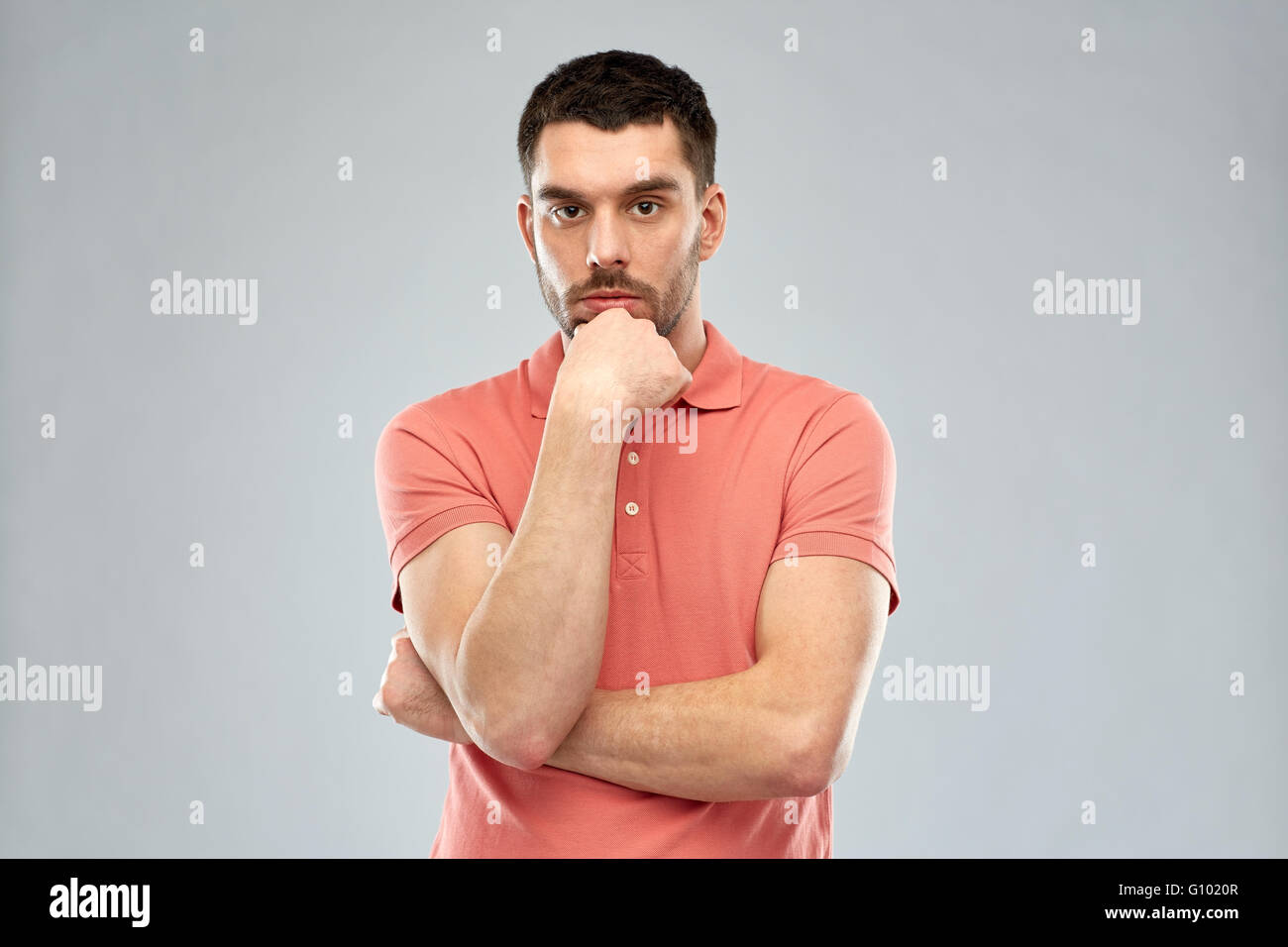 man thinking over gray background Stock Photo - Alamy