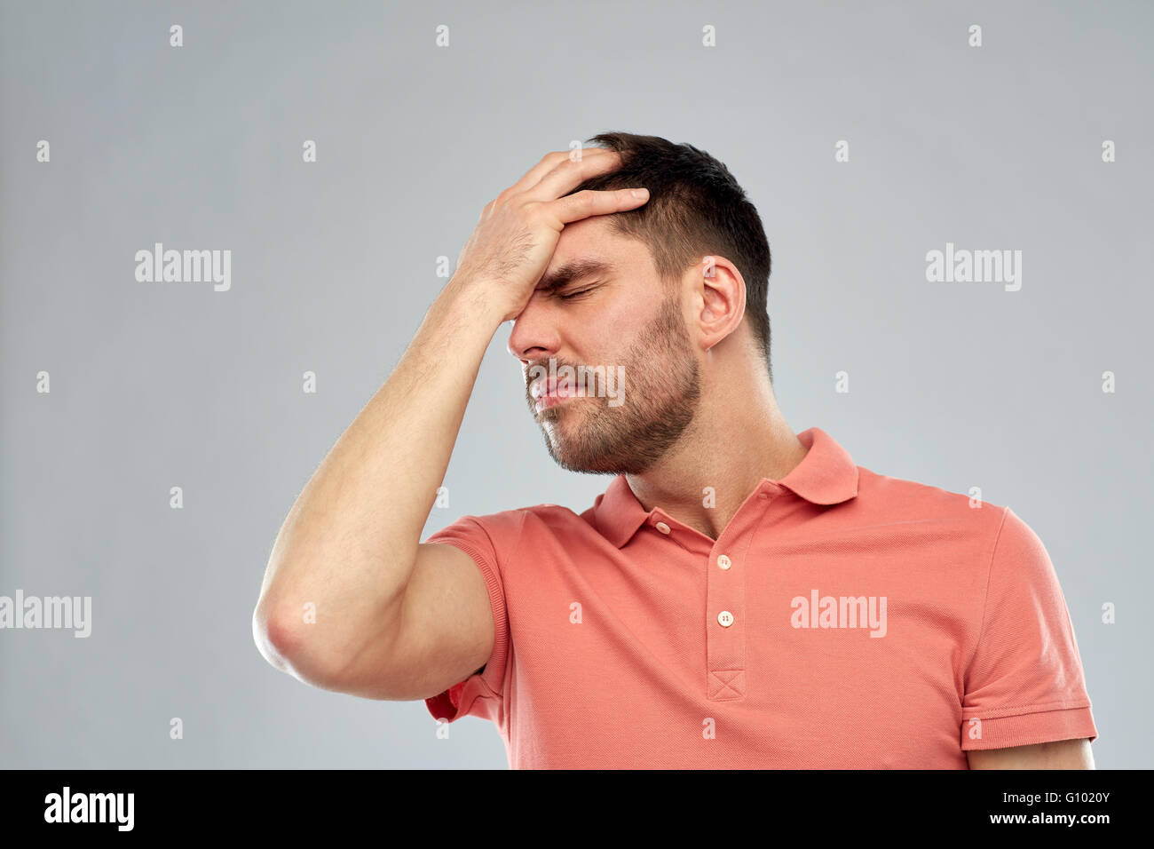 unhappy man suffering from head ache Stock Photo - Alamy