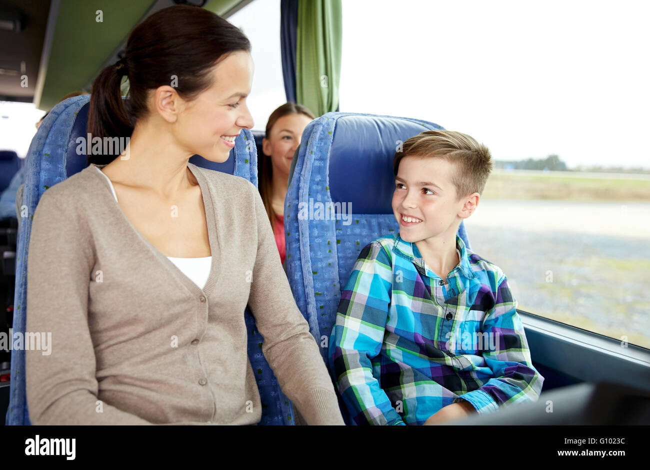happy family riding in travel bus Stock Photo - Alamy