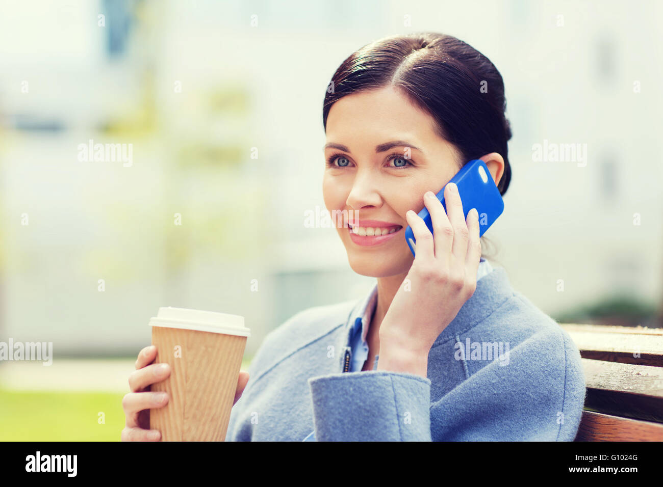 Calling businesswoman drinking coffee sitting hi-res stock photography ...