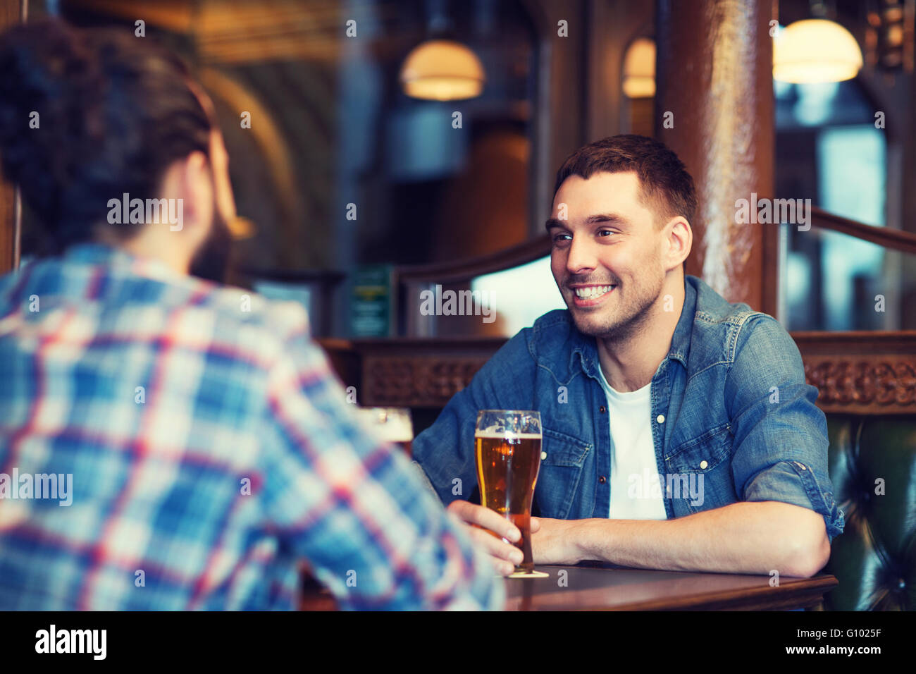 happy male friends drinking beer at bar or pub Stock Photo - Alamy