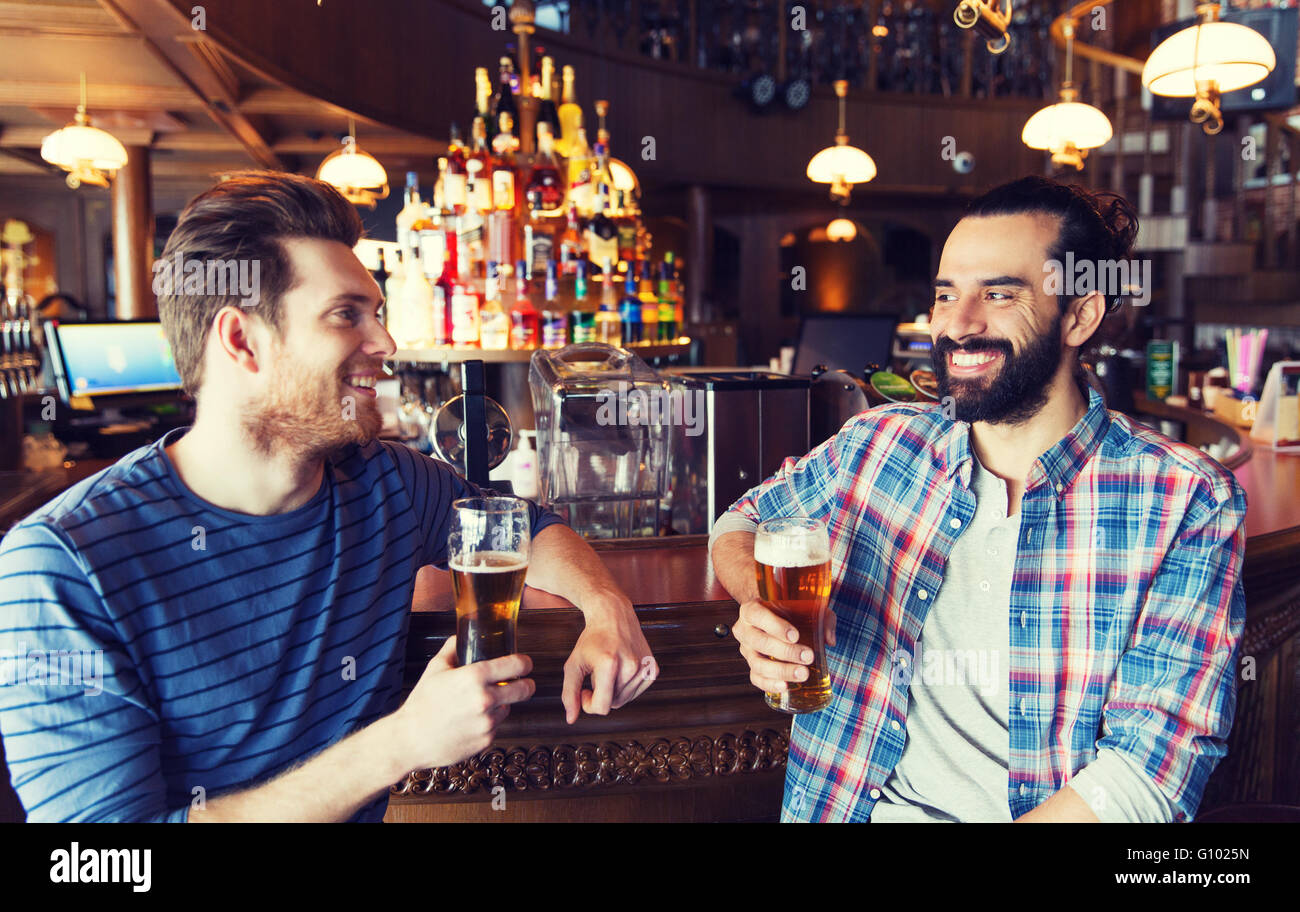Smiling guys drinking alcohol drinks hi-res stock photography and ...