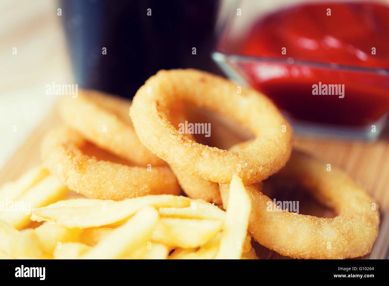 close up of fast food snacks and drink on table Stock Photo - Alamy