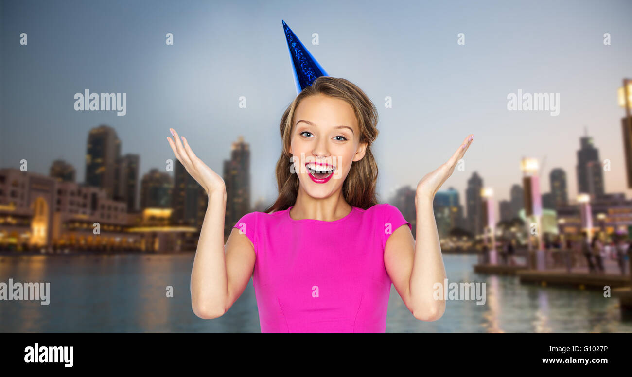 happy young woman or teen girl in party cap Stock Photo - Alamy