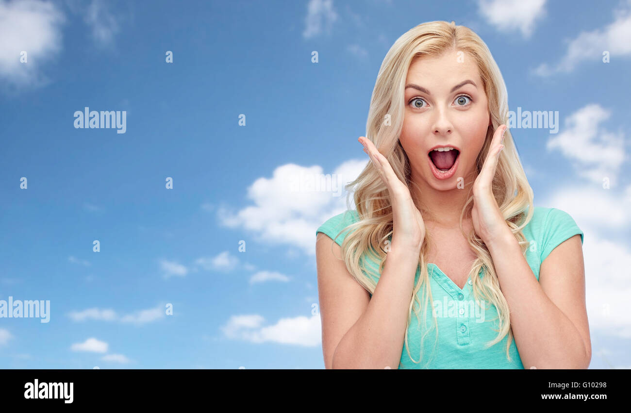 surprised smiling young woman or teenage girl Stock Photo - Alamy