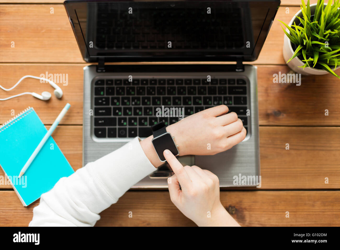 close up of woman with smart watch and laptop Stock Photo - Alamy