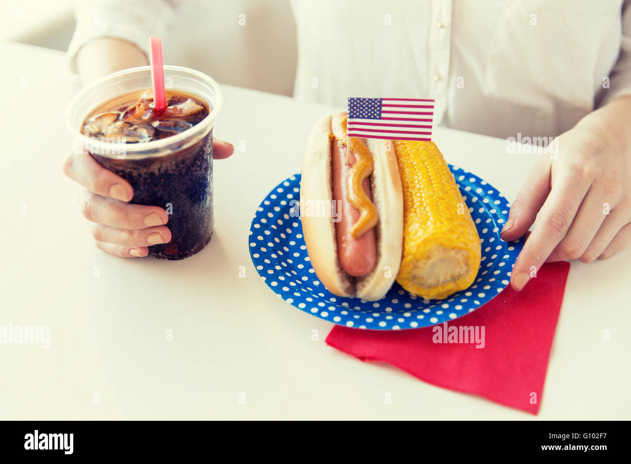 Woman eating corn dog hi-res stock photography and images - Alamy