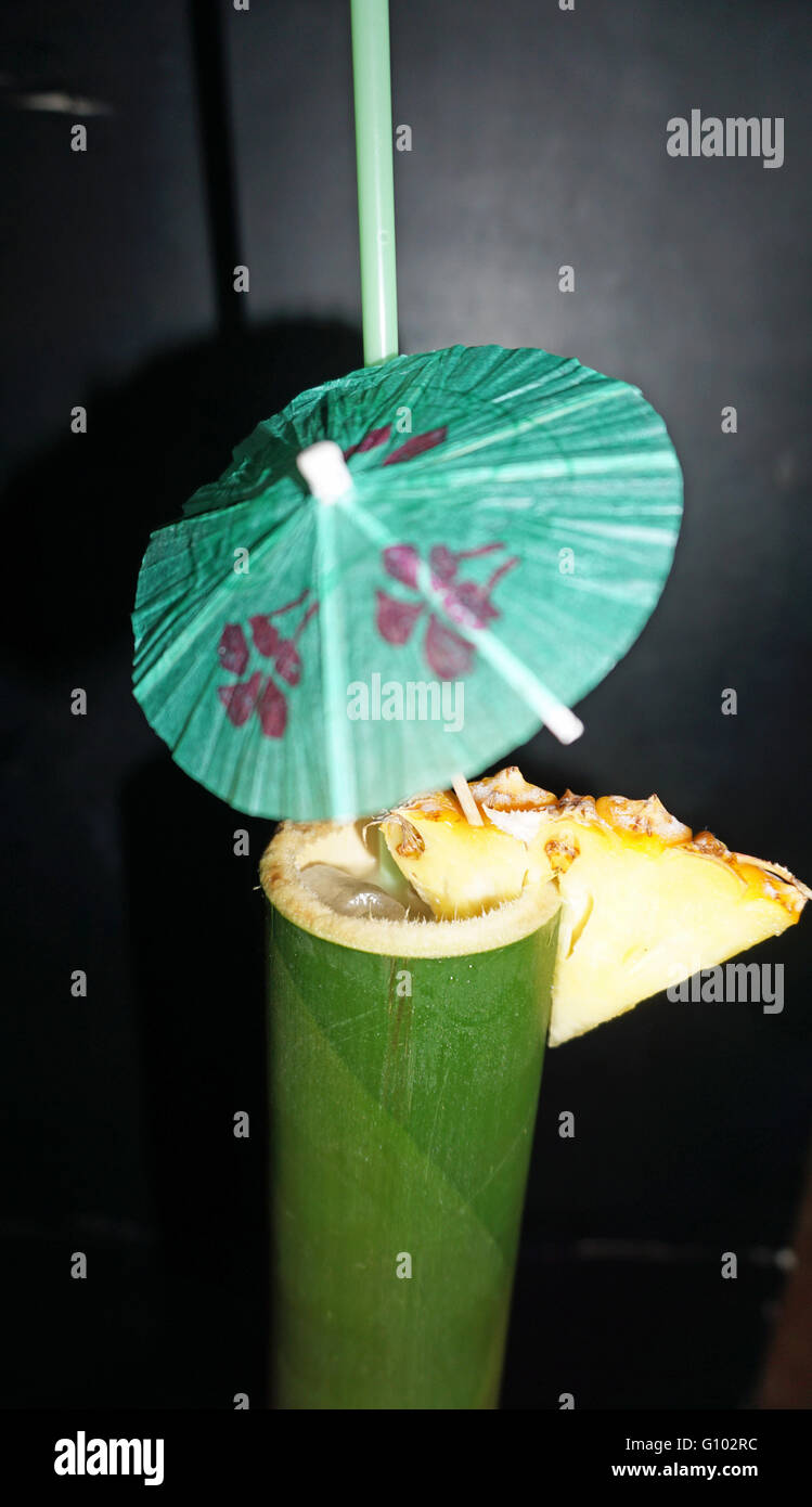 cocktail served in a bamboo pipe Stock Photo - Alamy