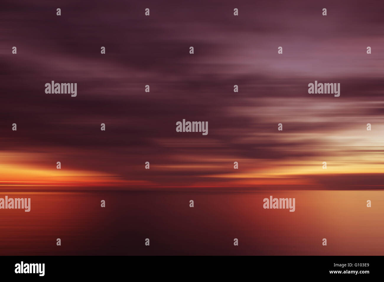 Blurred sunset above the sea Stock Photo - Alamy