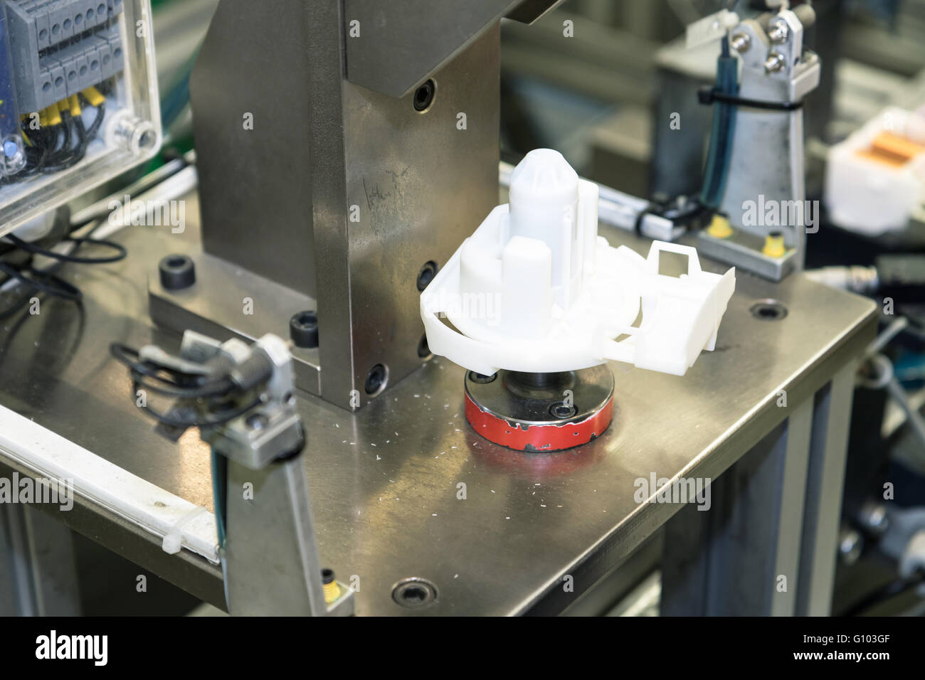 Assembly line of plastic components. Closeup view of the work table ...
