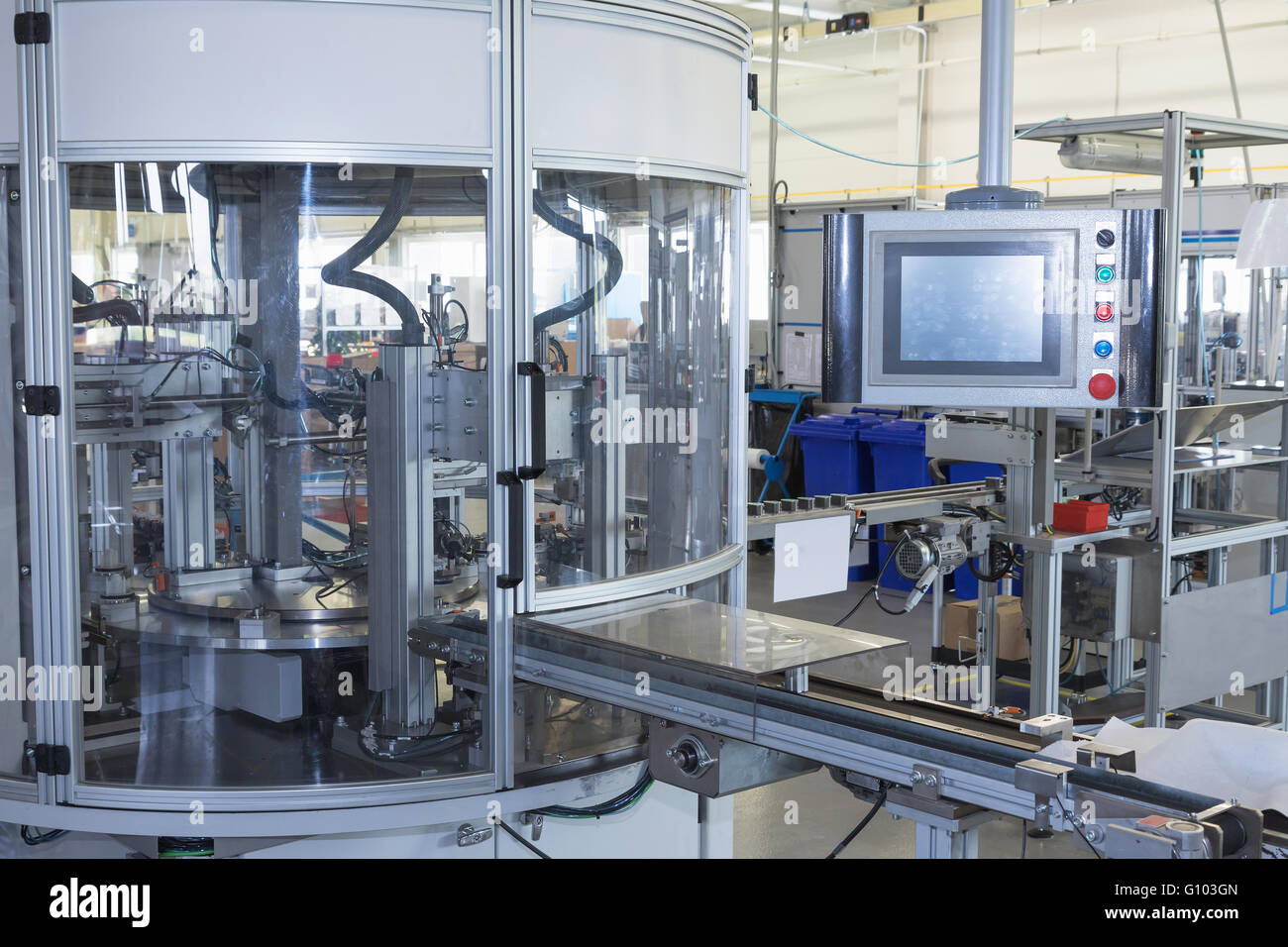 General view of the automatic production line with a control panel. All ...