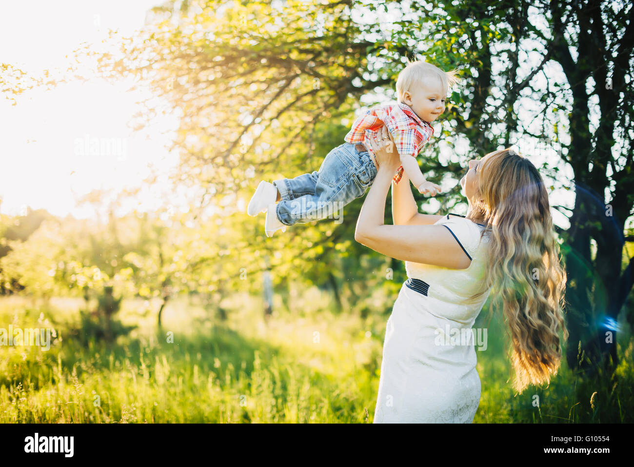 Mom throws son Stock Photo - Alamy