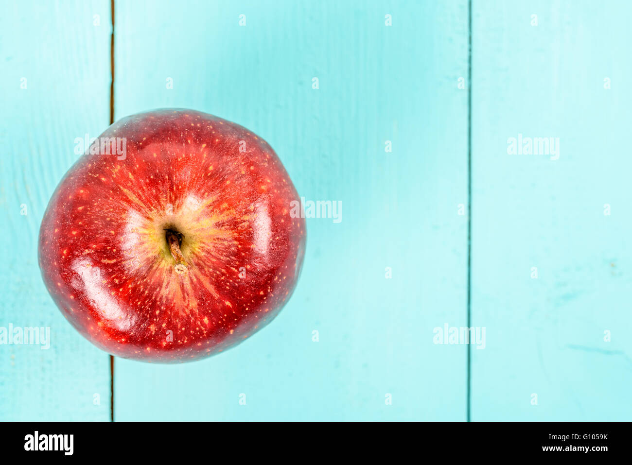 Fresh Red Delicious Apple On Turquoise Wood Table Stock Photo - Alamy