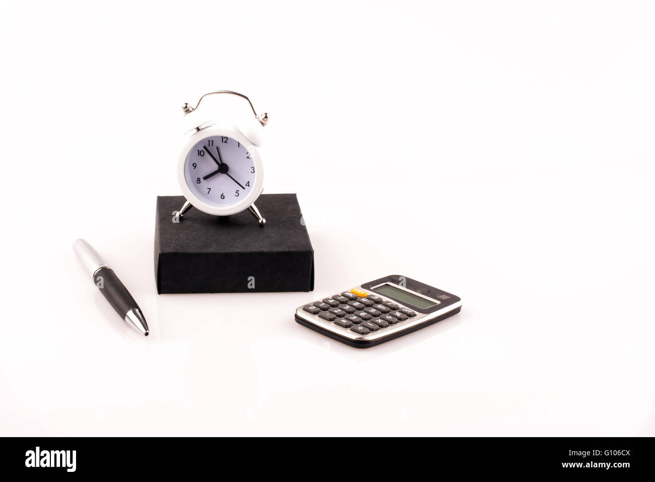 Notebook, alarm clock and calculator on white background Stock Photo ...
