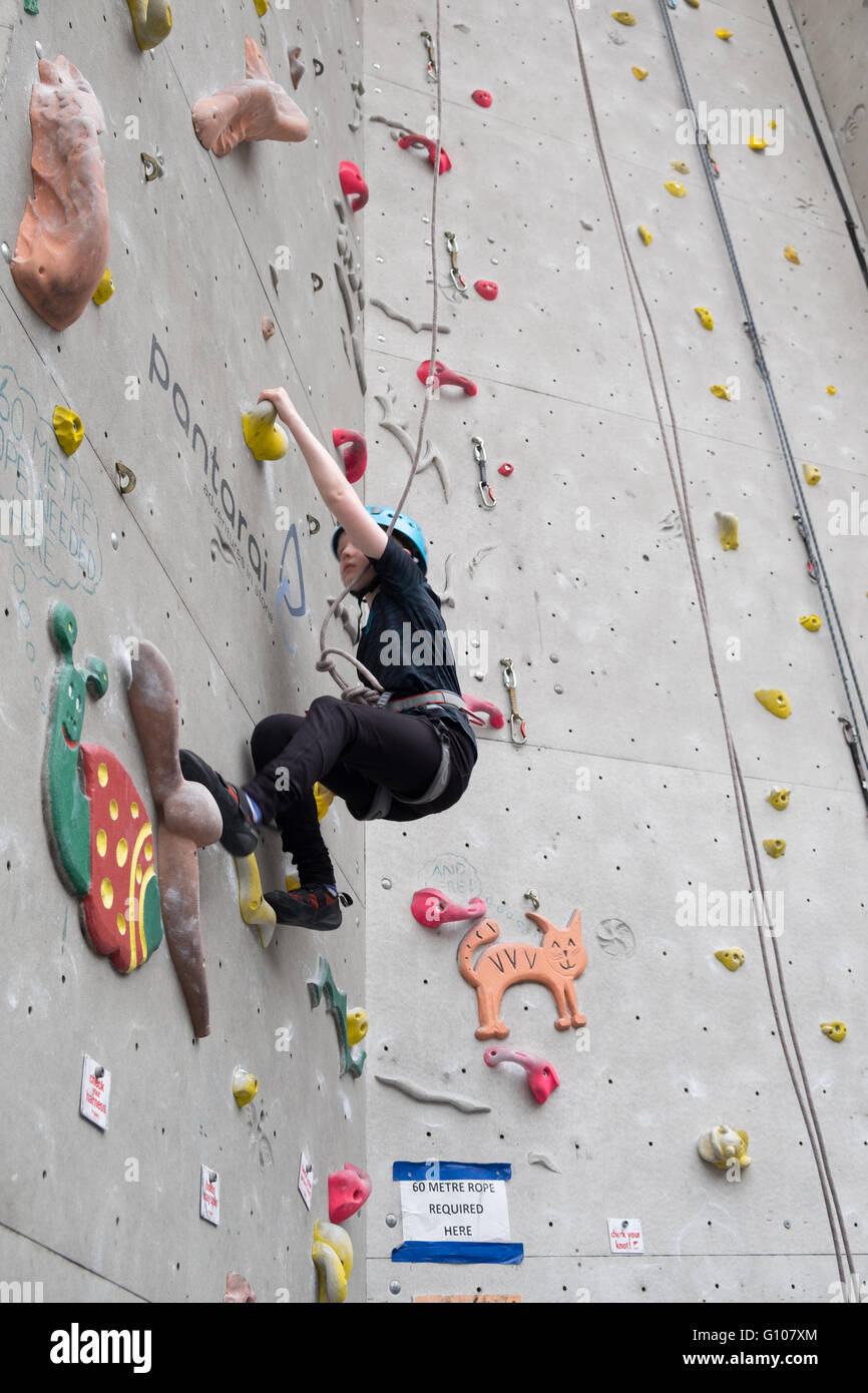 A young boy climbing at the national indoor climbing centre in Ratho ...