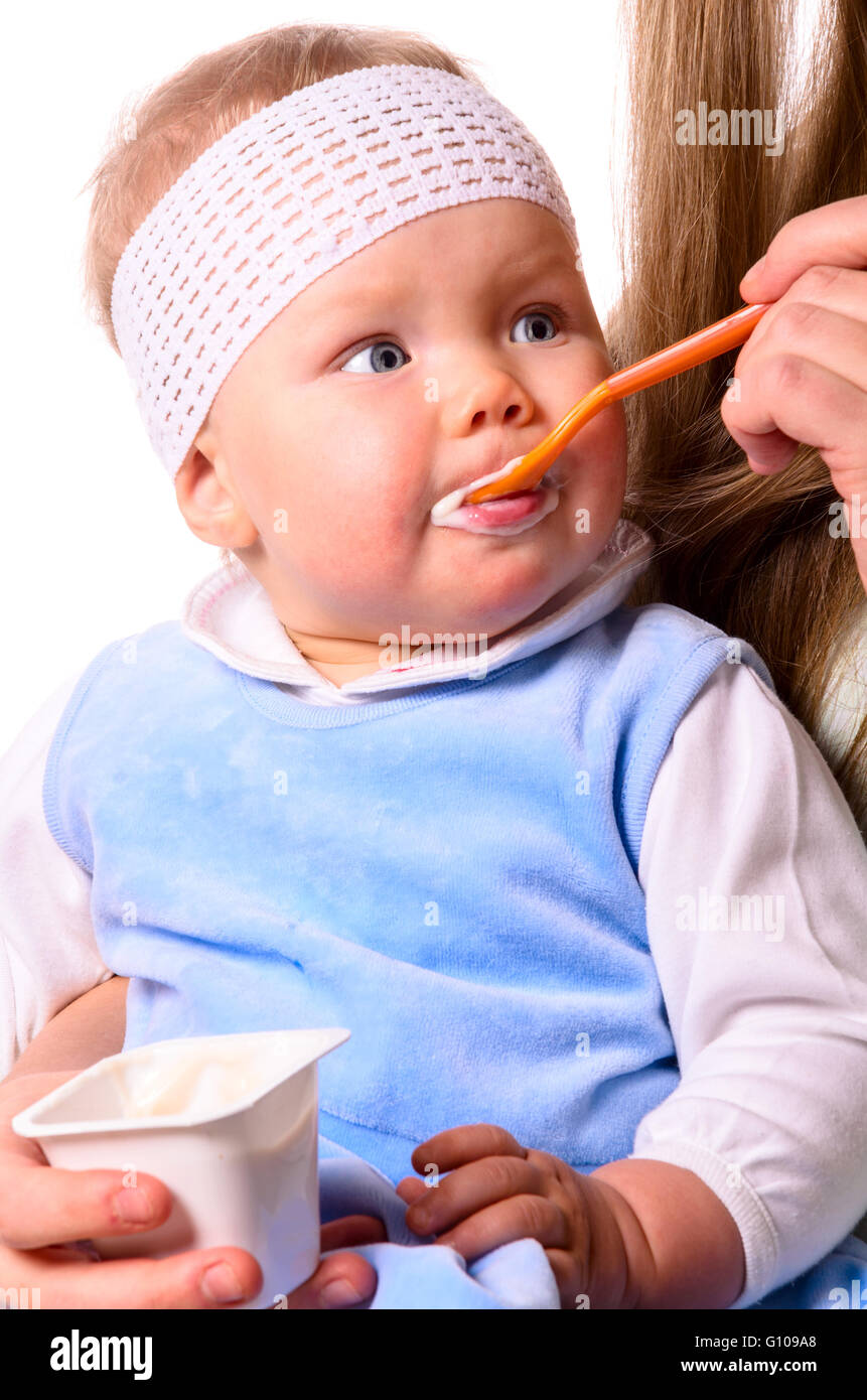woman is feeding her baby Stock Photo - Alamy
