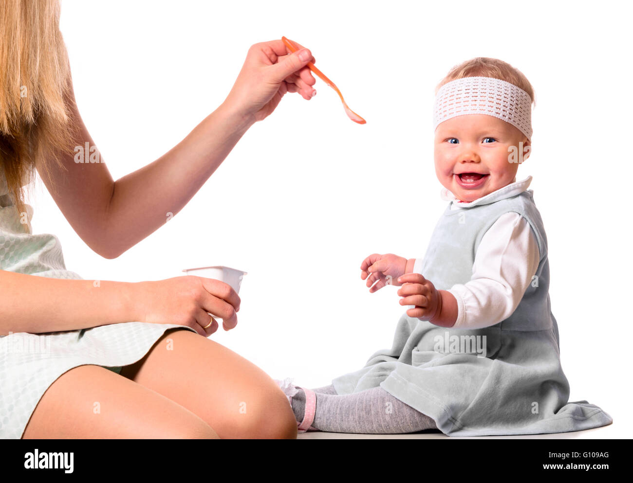 woman is feeding her baby Stock Photo - Alamy