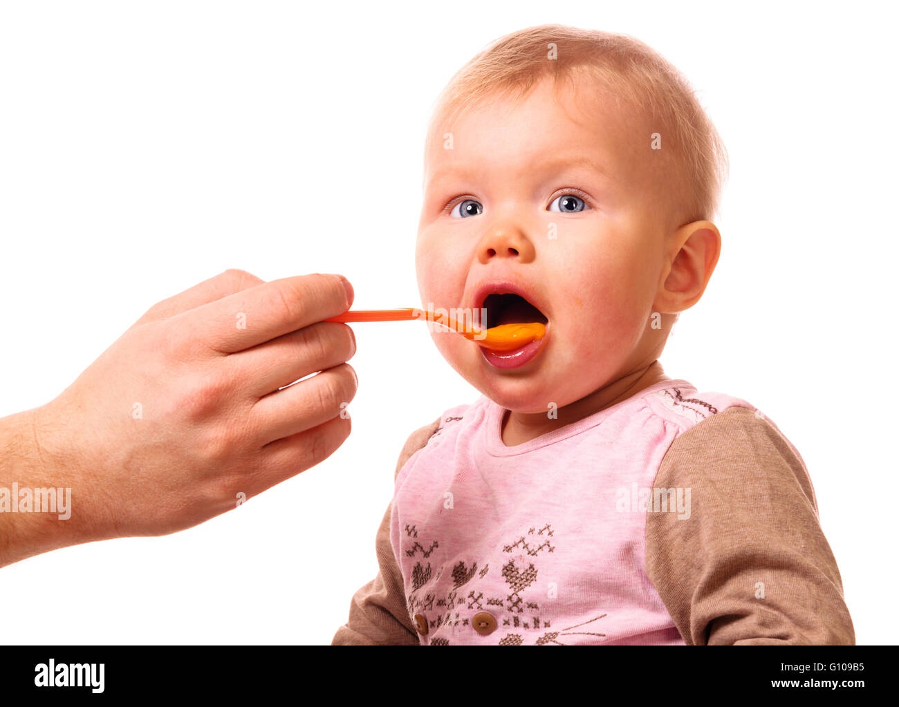 man is feeding his baby Stock Photo - Alamy