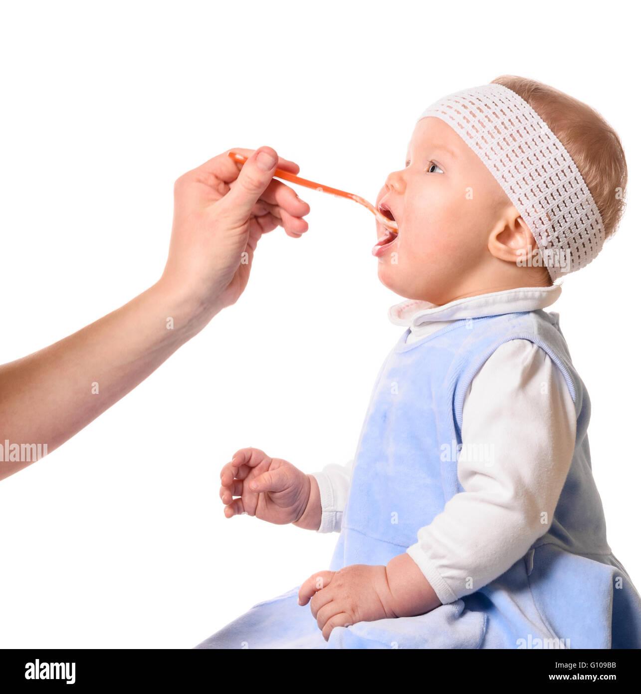 woman is feeding her baby Stock Photo - Alamy