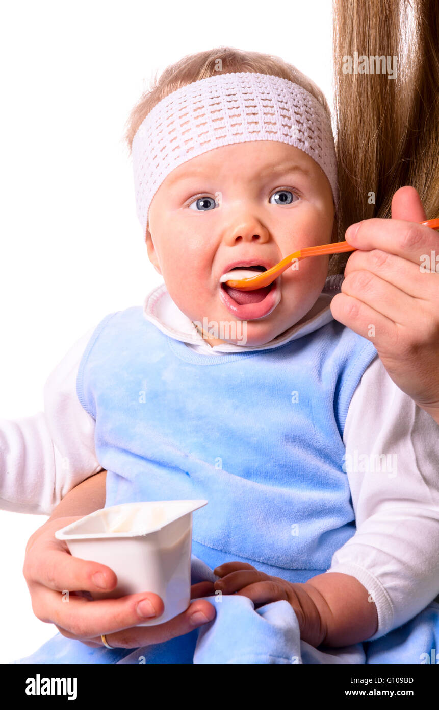 woman is feeding her baby Stock Photo - Alamy