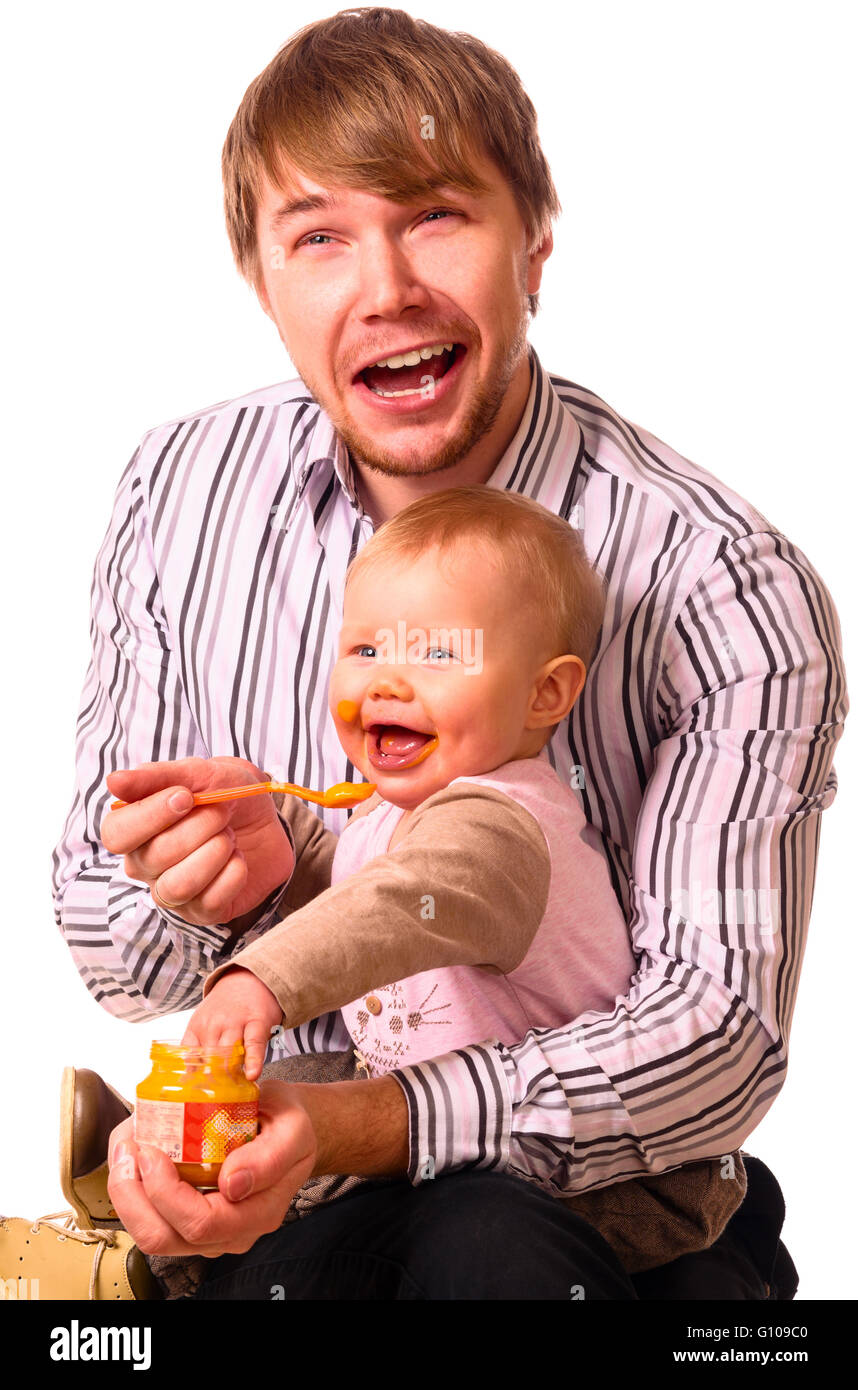 man is feeding his baby Stock Photo - Alamy