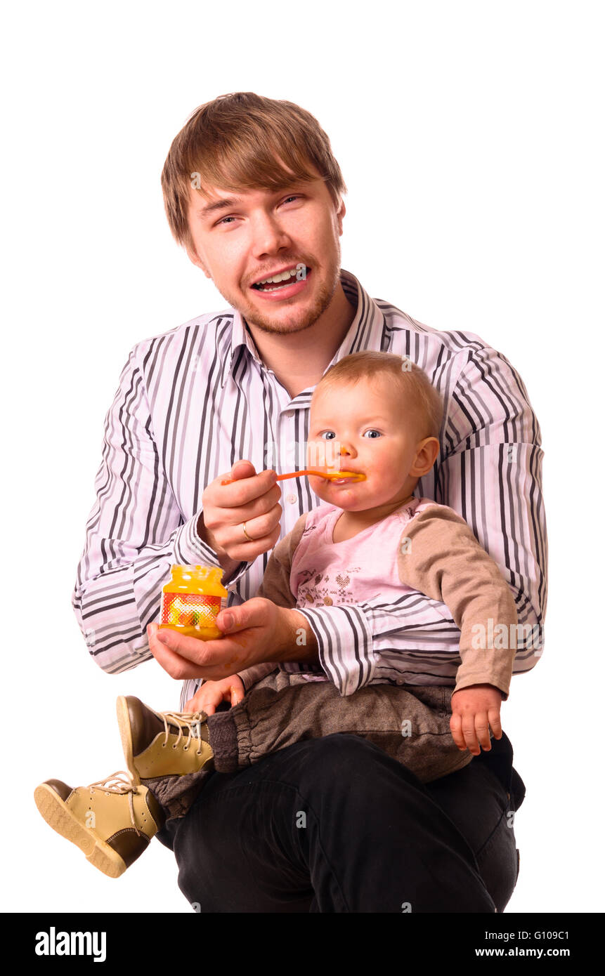 man is feeding his baby Stock Photo - Alamy