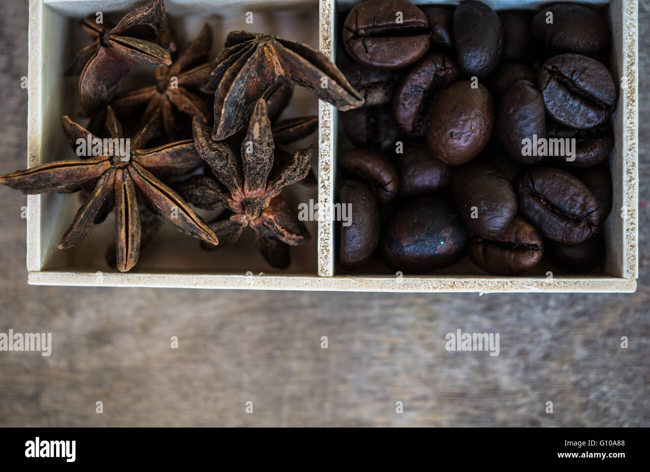 Coffee beans on rustic background Stock Photo - Alamy
